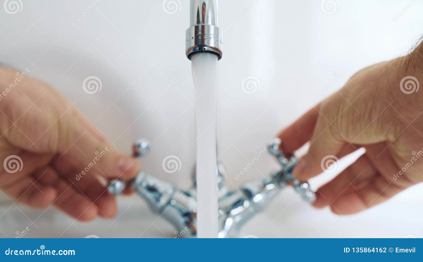 The Man in the Bathroom with Two Hands Regulates the Temperature of the ...