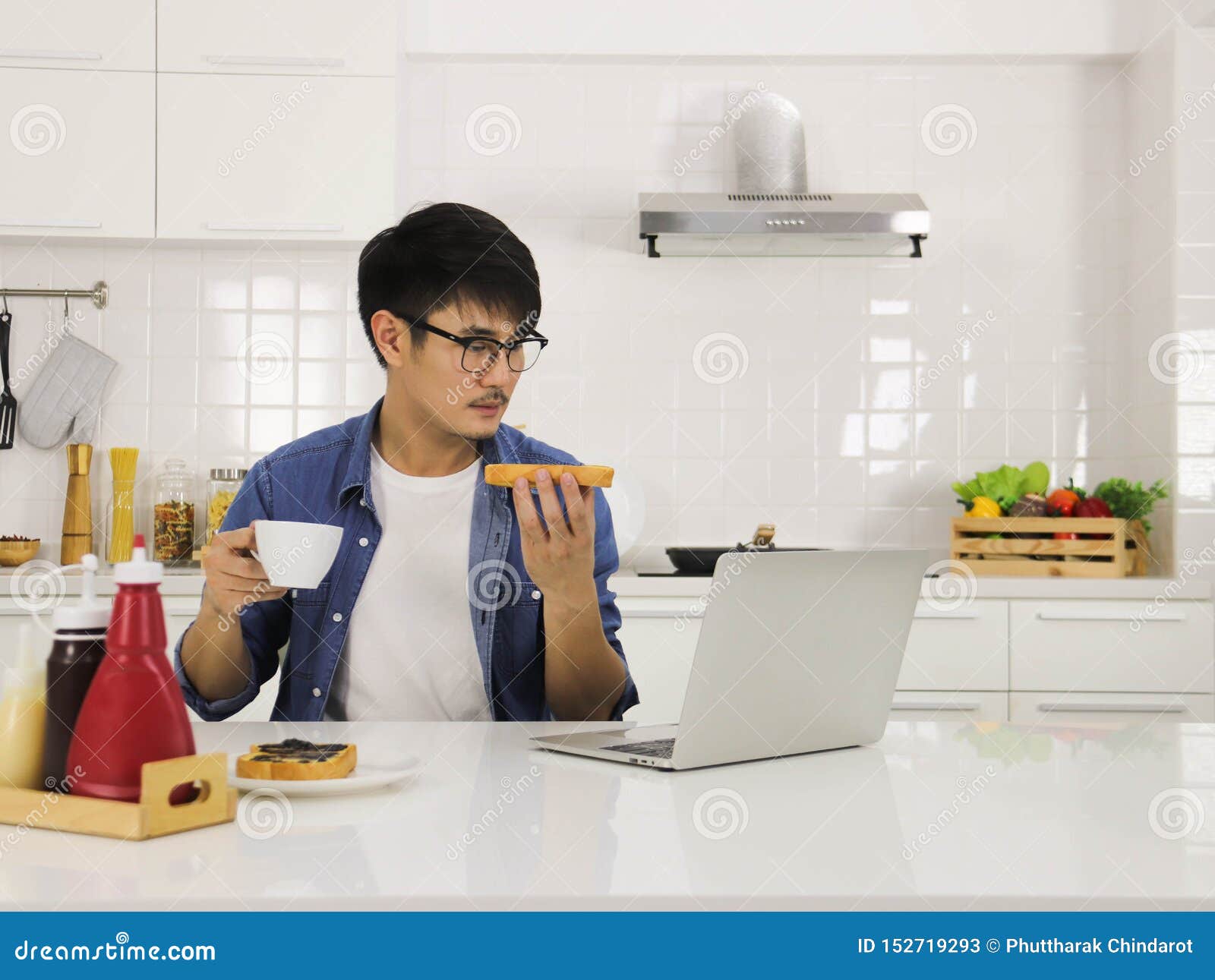A Man Baving Breakfast while Working on Computer Stock Image - Image of ...