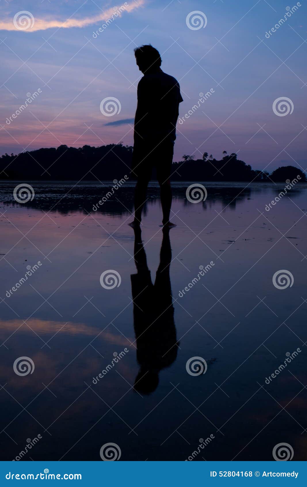 Man on the Beach with Reflection in Water during Sunset. Stock Photo ...