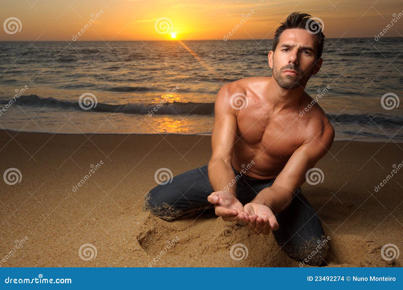 Man on the beach at sunset stock photo. Image of beach - 23492274