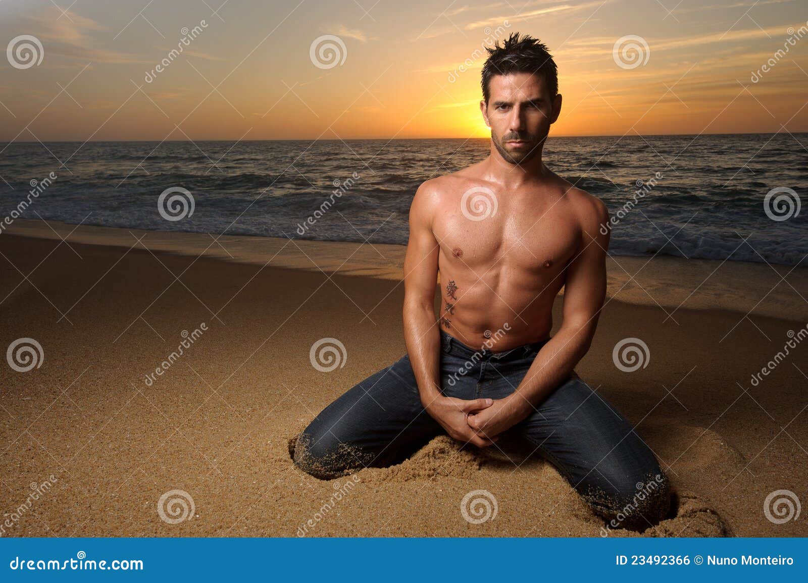 Man on the beach at sunset stock photo. Image of confident - 23492366