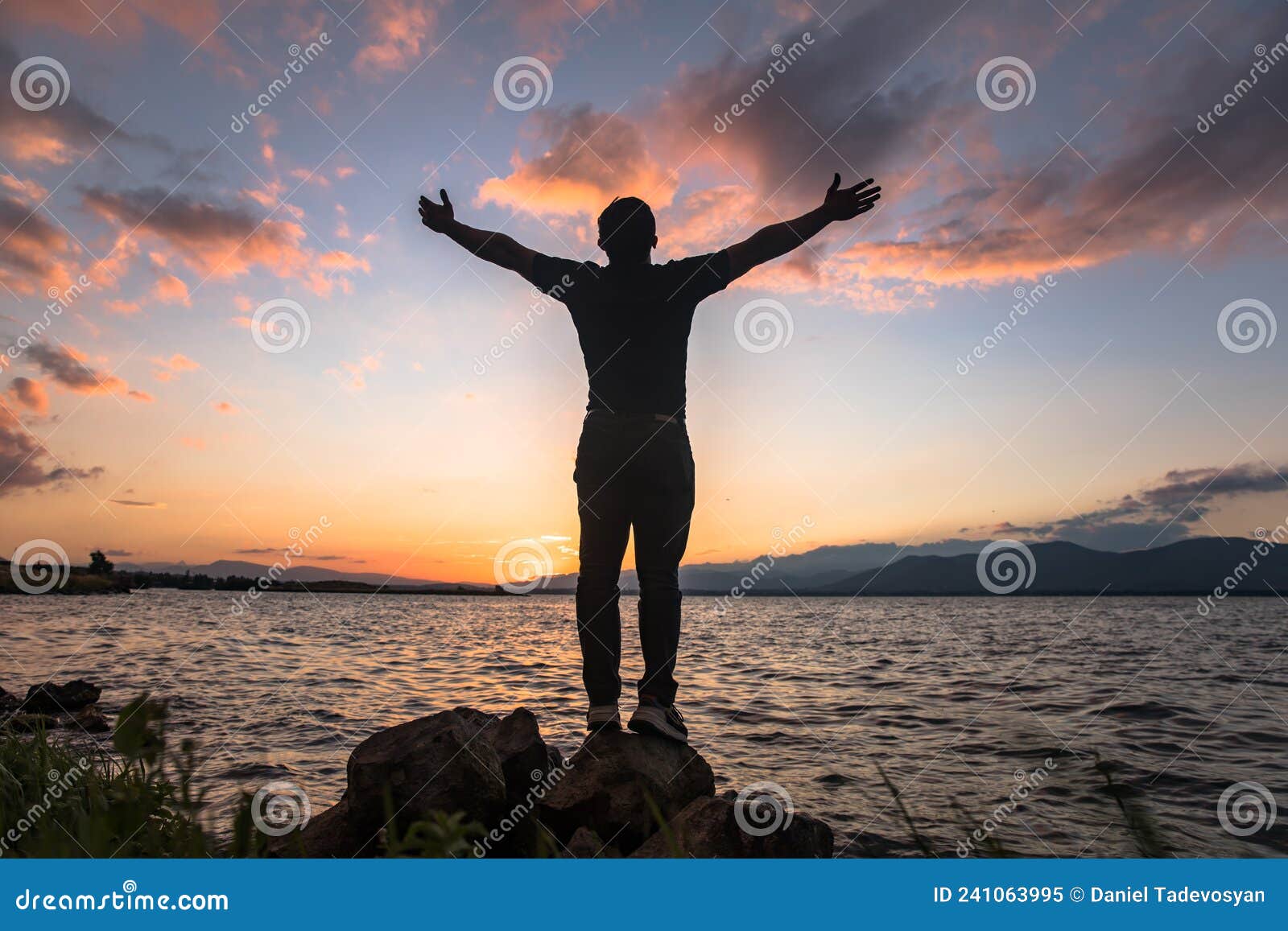 Man in the beach at sunset stock image. Image of view - 241063995
