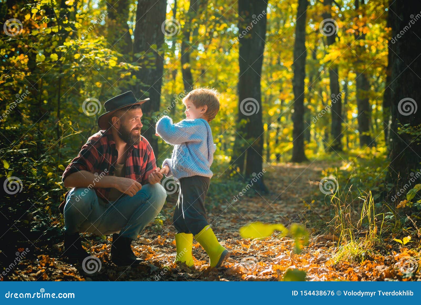 Man With Beard Dad With Young Son In Autumn Park Father And Son