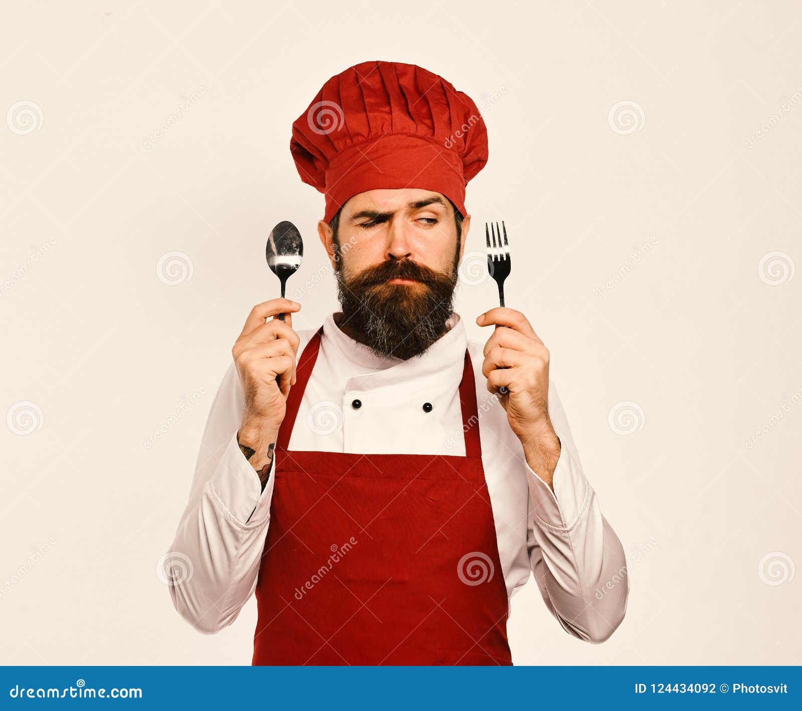 Man With Beard Holds Fork And Spoon On White Background. Stock Photo ...