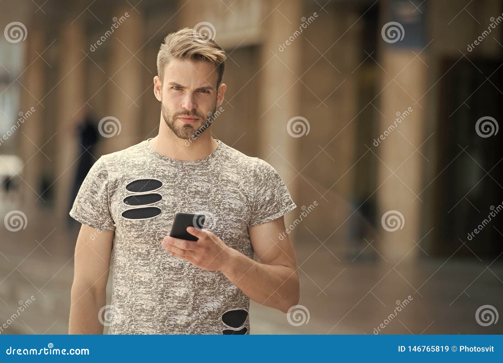 Man With Beard Walks With Smartphone Urban Background Guy Use