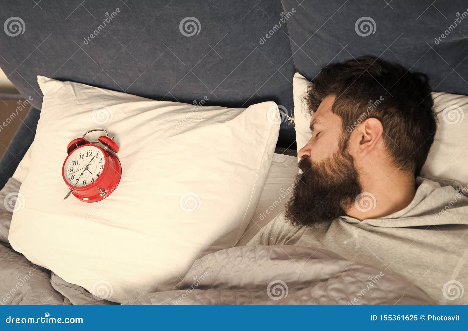Man Bearded Hipster Sleepy Face In Bed With Alarm Clock Problem With