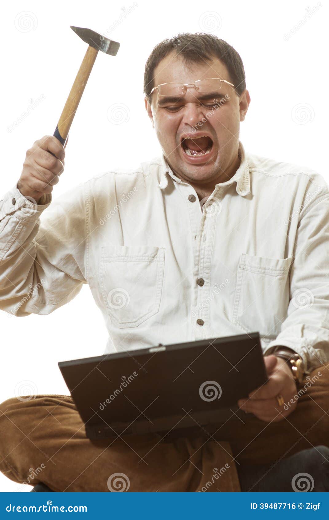 Man beats hammer on laptop stock photo. Image of person - 39487716