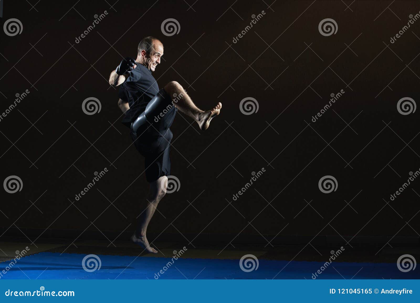Strong Man Beats with a Kick Leg Stock Image - Image of black, defense ...