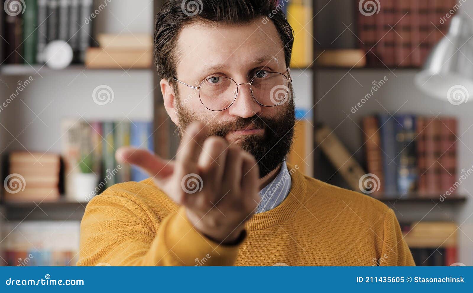 Bearded Man In Glasses Pointing Up With Fingers Looking Amazed And