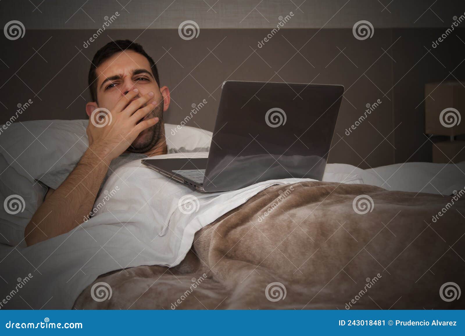 Man in bed with computer stock image. Image of businessman - 243018481