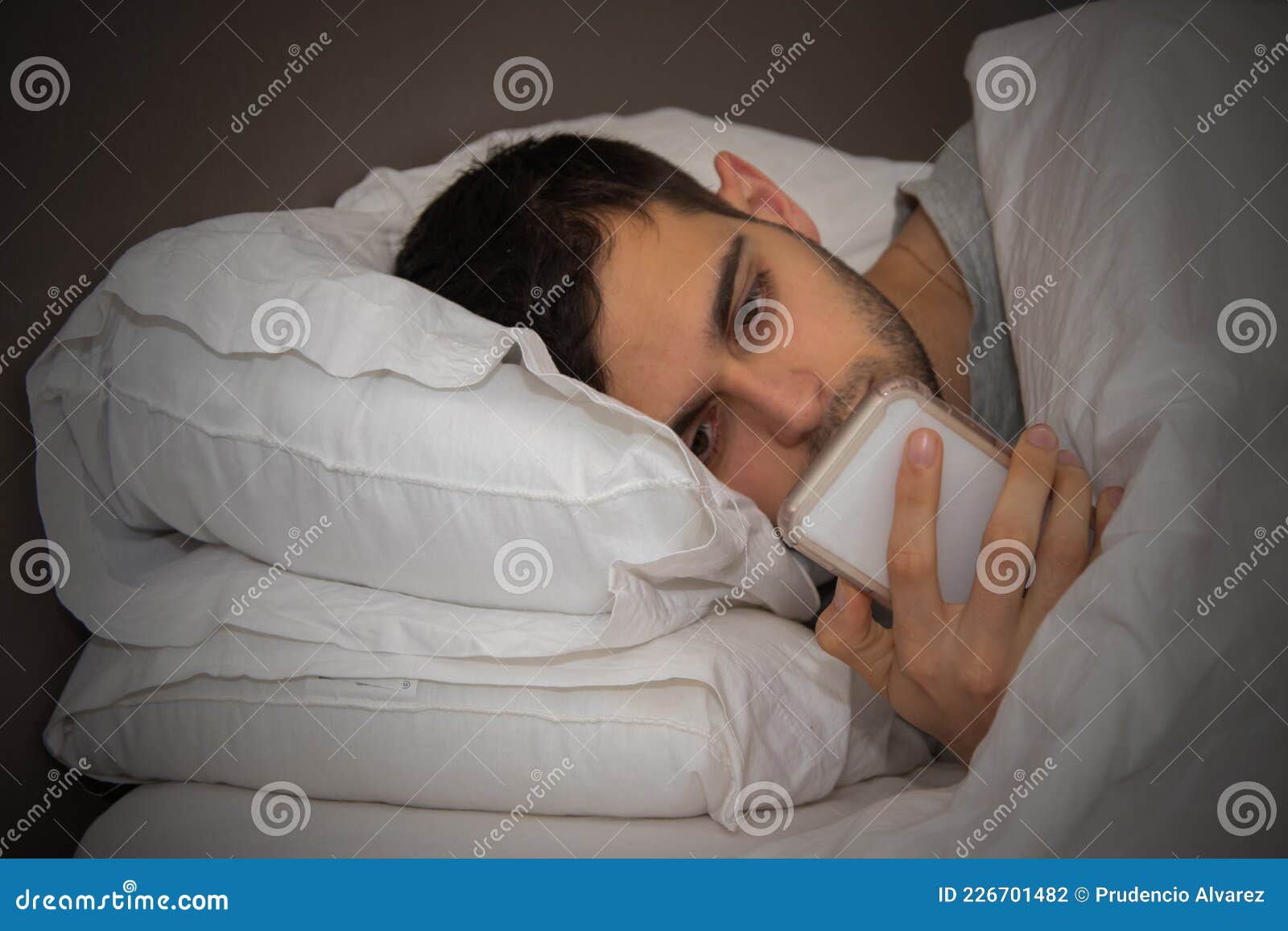 Man in bed with insomnia stock photo. Image of cyberspace - 226701482