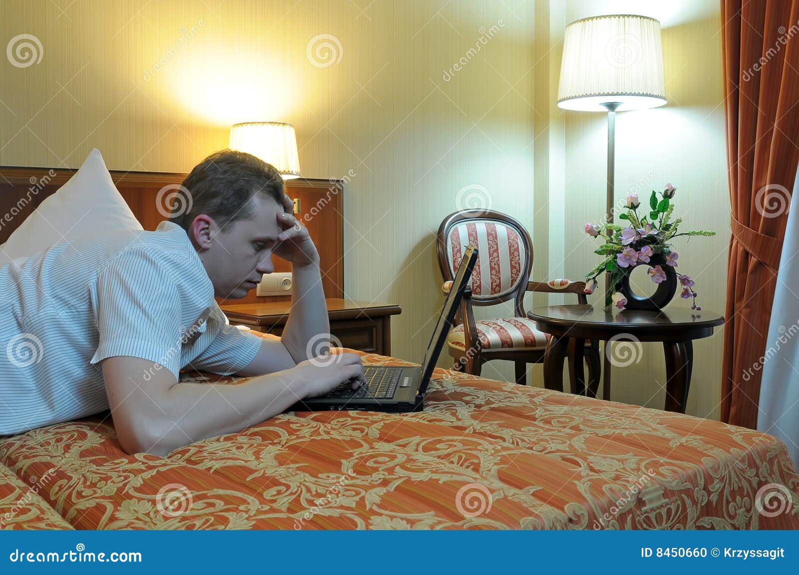 Man on bed using computer stock photo. Image of connected - 8450660