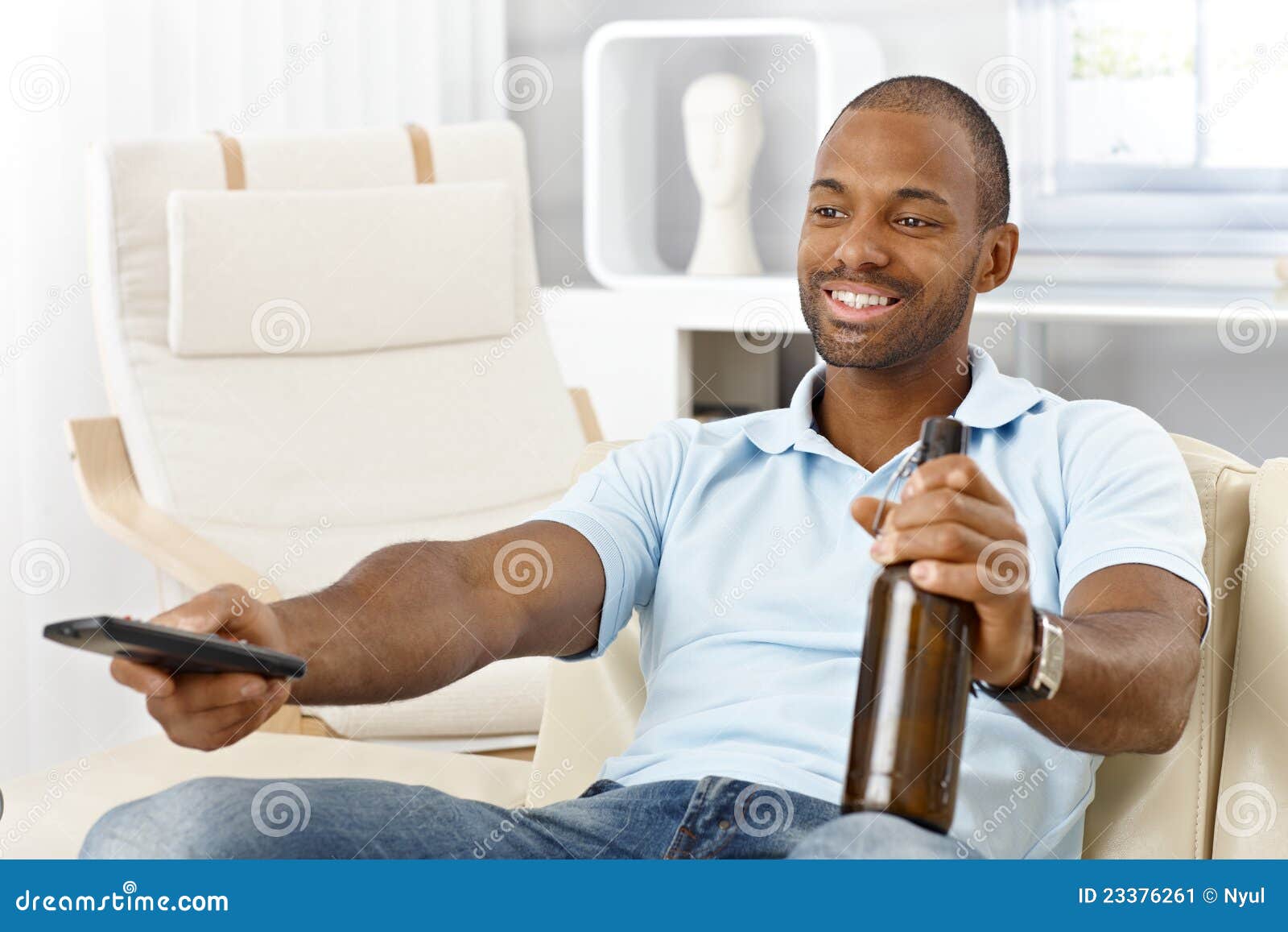 Man with Beer and Remote Control Stock Image - Image of enjoy, black ...