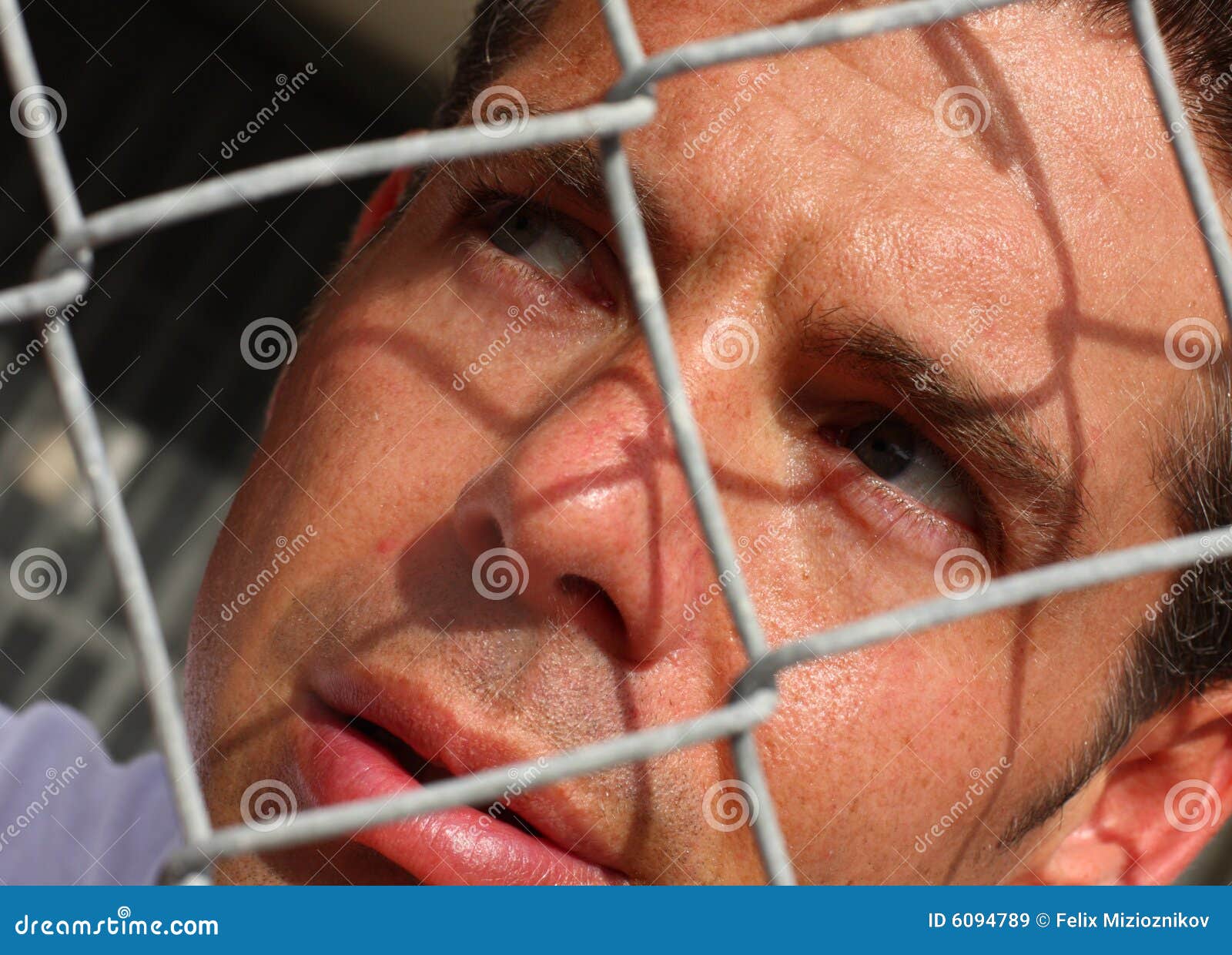 Man Behind a Fence stock image. Image of handsome, white - 6094789