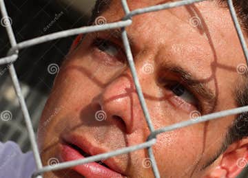Man Behind a Fence stock image. Image of handsome, white - 6094789