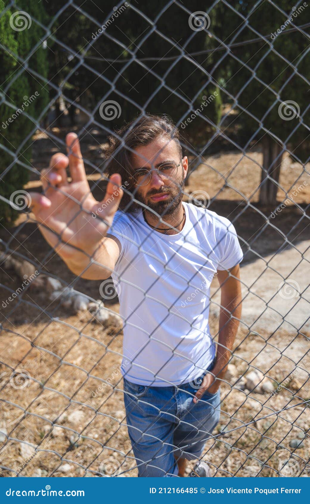 Man behind a fence stock image. Image of depression - 212166485