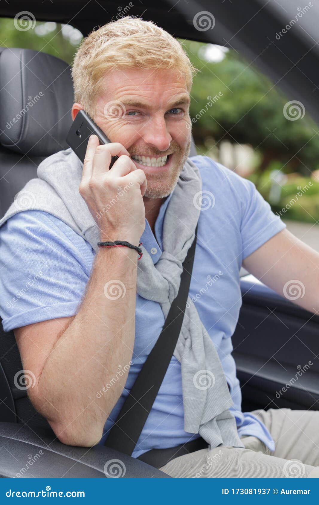 Man Behind Wheel Giggling while on Phone Stock Image - Image of ...