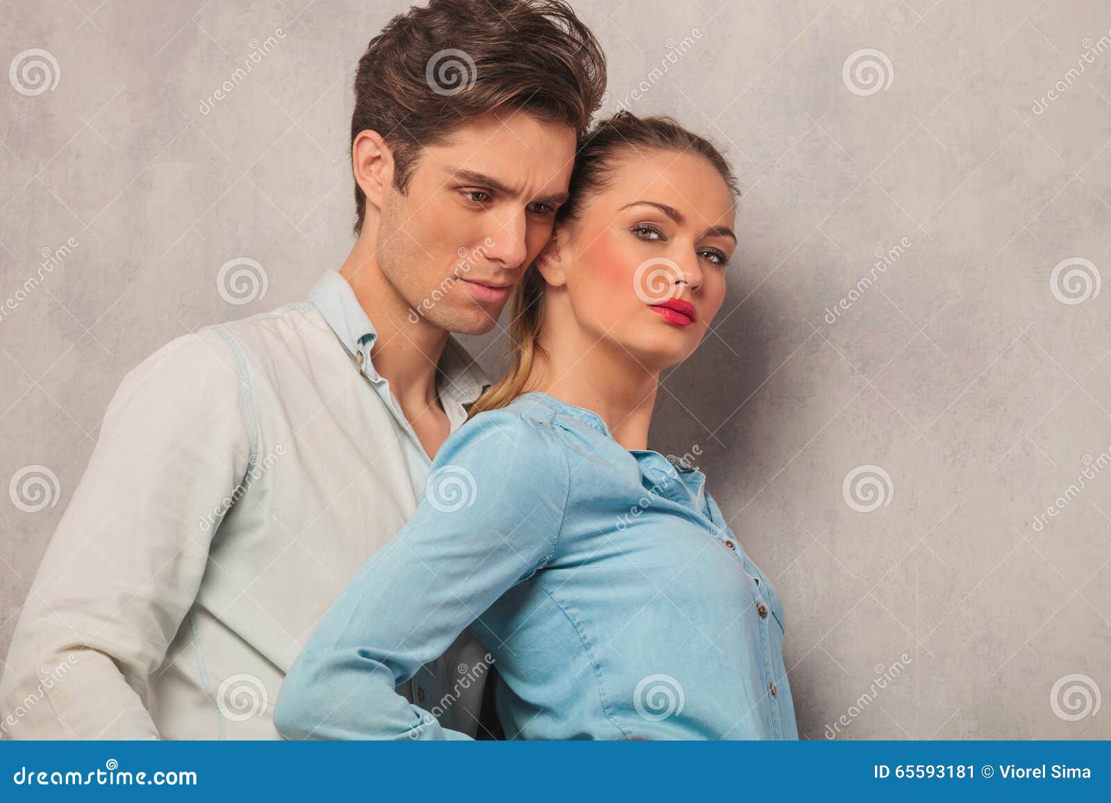 Man Behind Woman, Posing in Studio Looking Down Stock Image - Image of ...