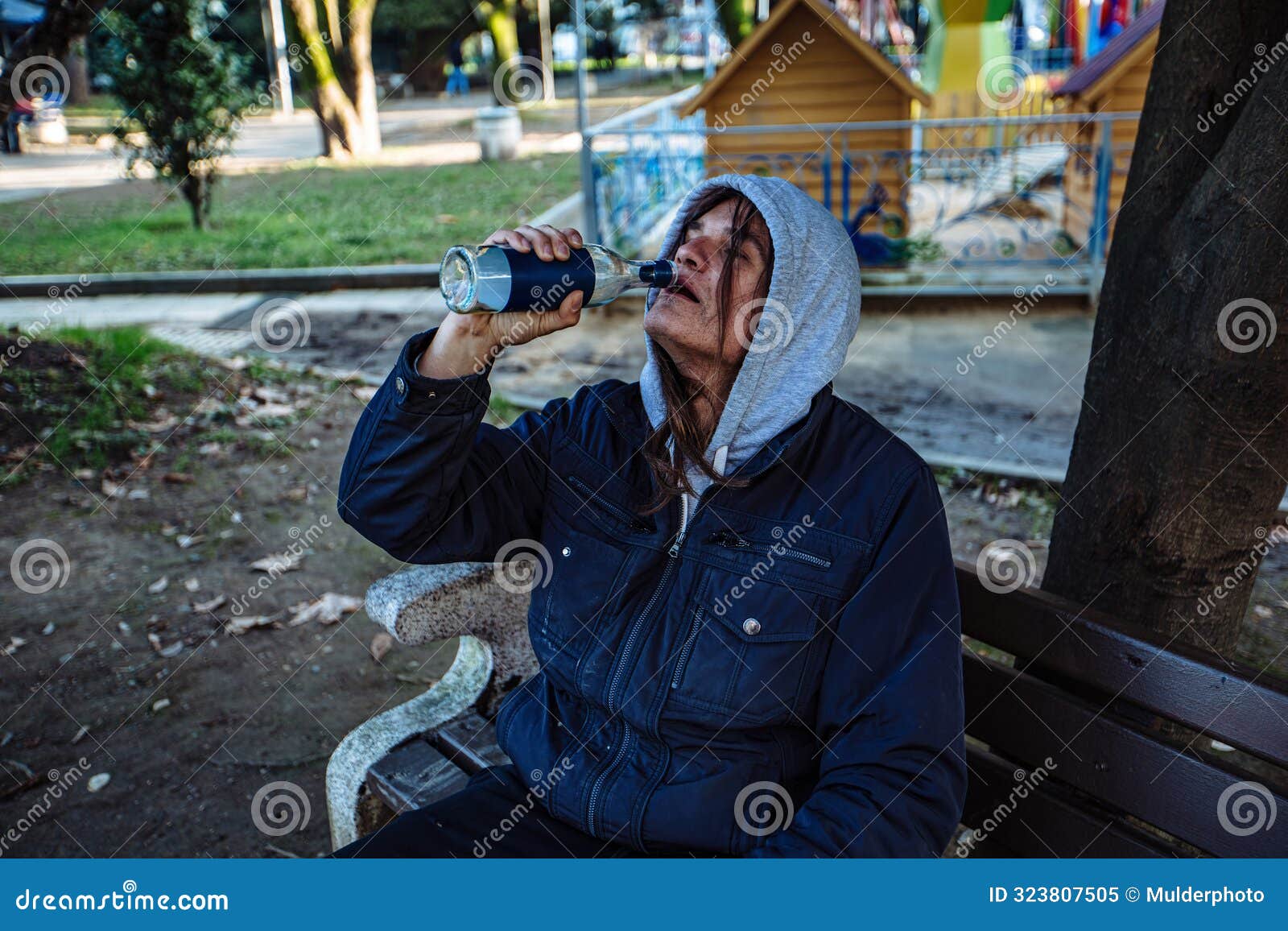 Man on Bench is Drinking Alcohol. Alcohol Addiction Concept Stock Image ...