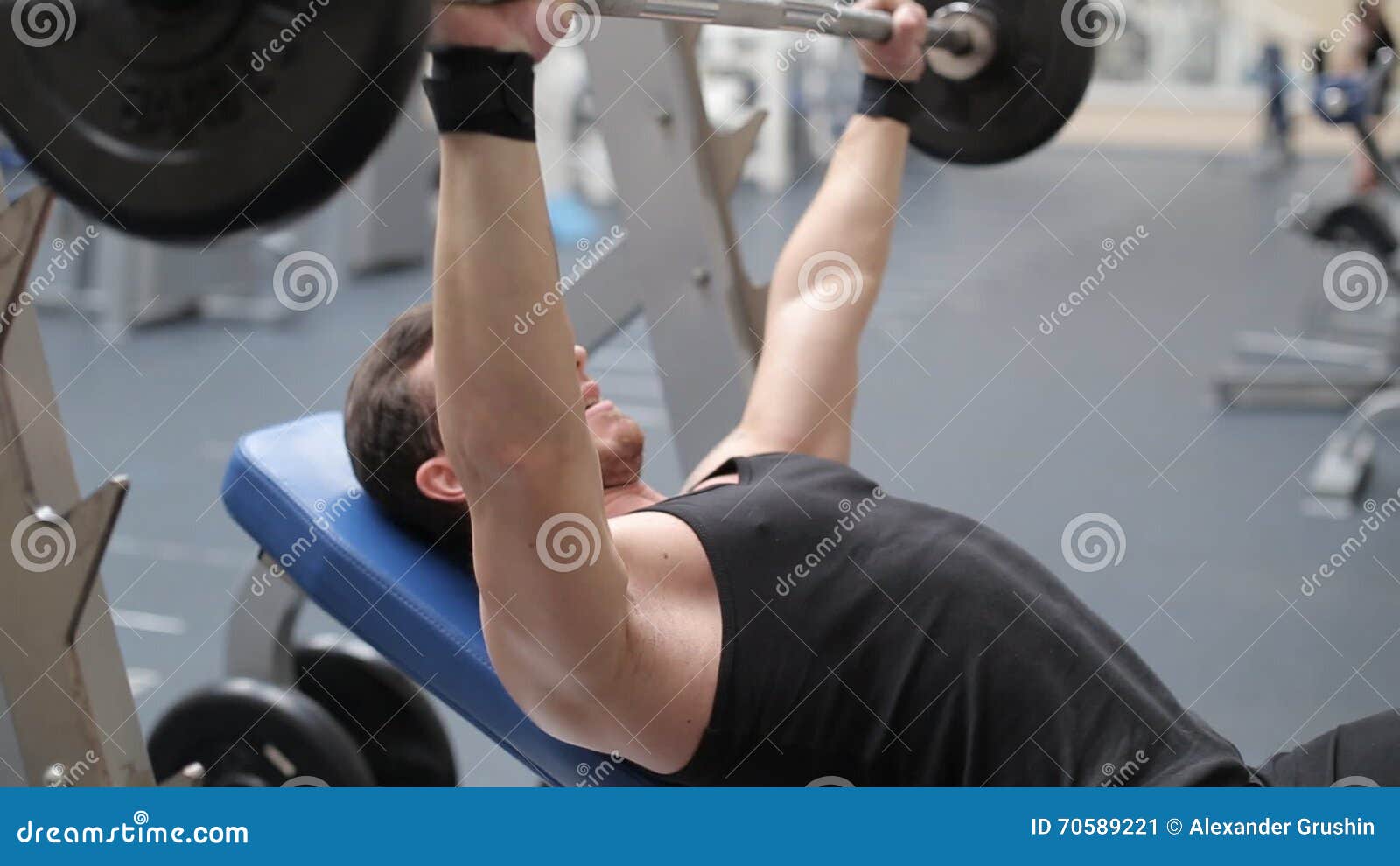 Man bench pressing weights stock video. Video of breathing - 70589221