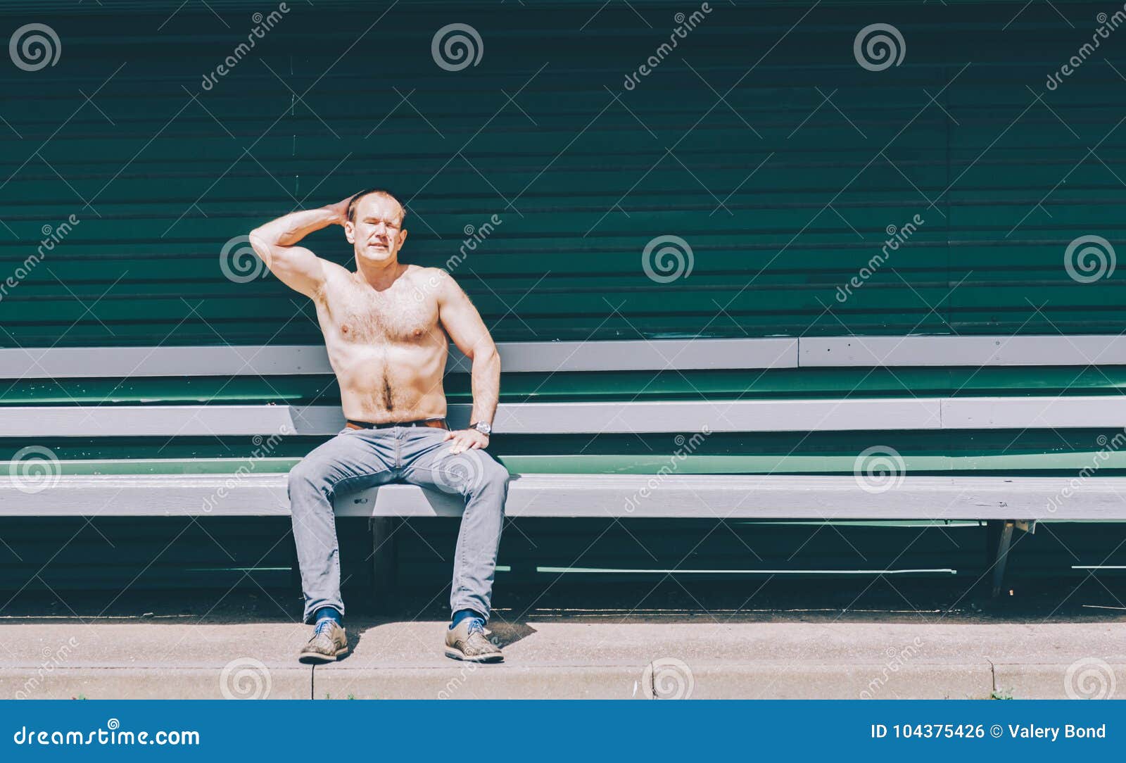Man on Bench stock photo. Image of beautiful, confident - 104375426