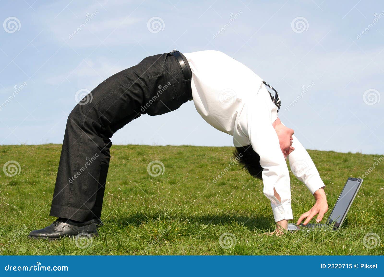 Man bending backwards stock image. Image of grass, outdoors - 2320715
