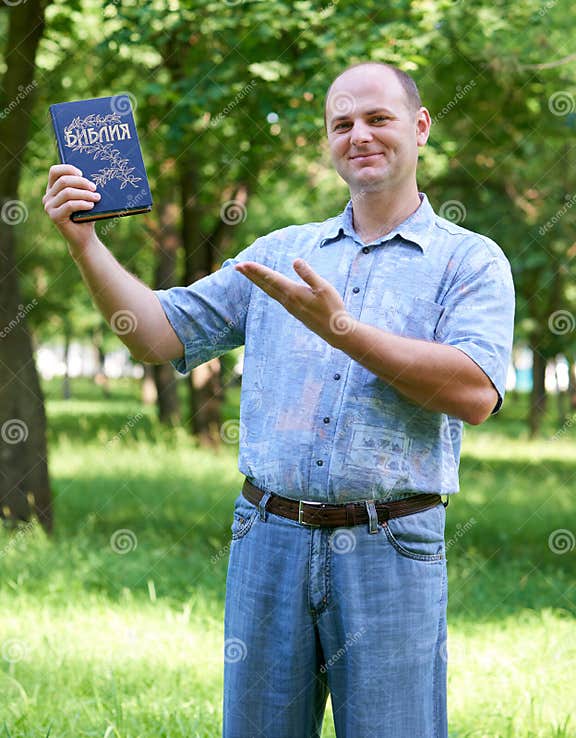 Man with a Bible in His Hand Stock Photo - Image of city, outdoor: 74144086