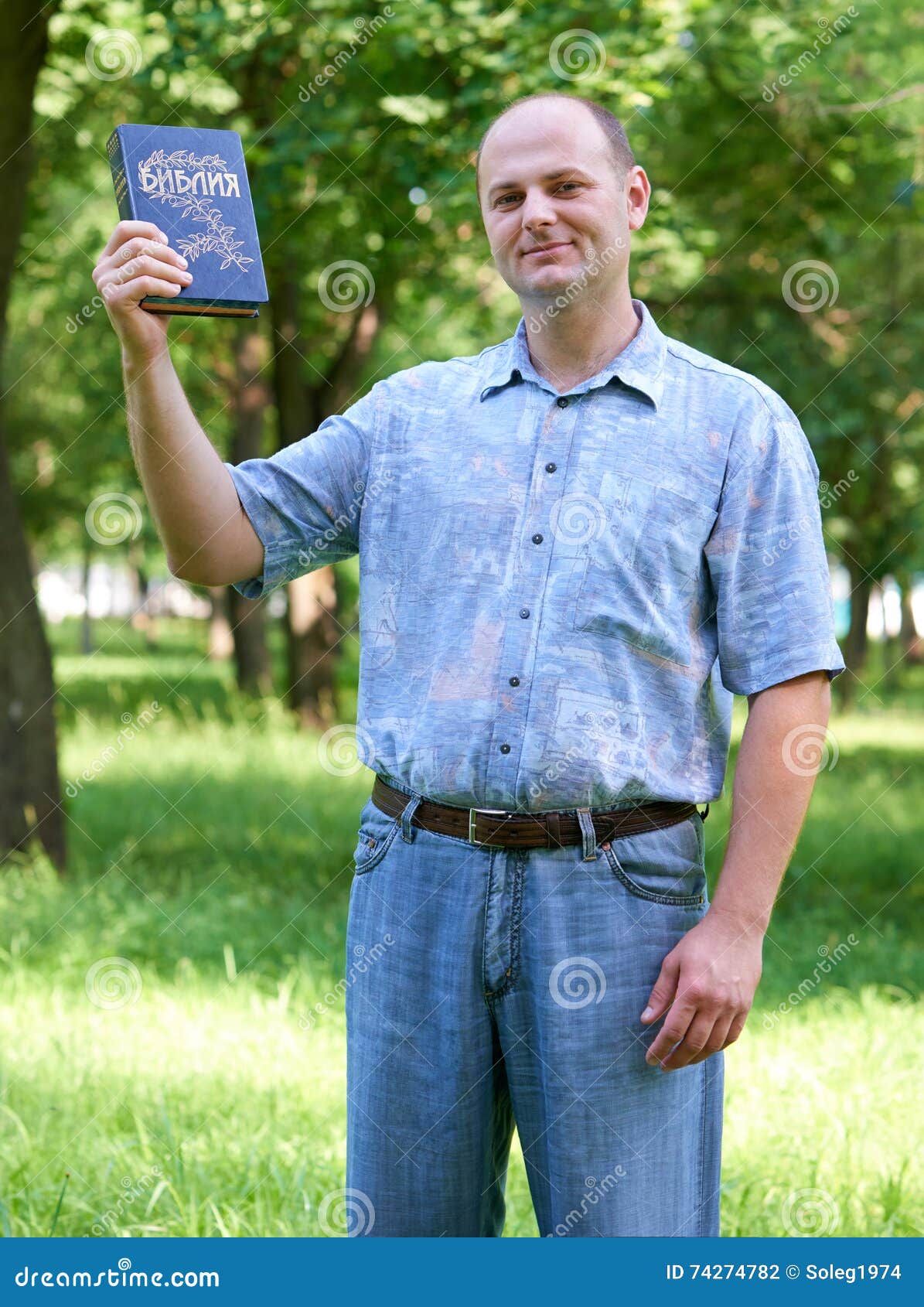 Man with a Bible in His Hand Stock Photo - Image of look, park: 74274782