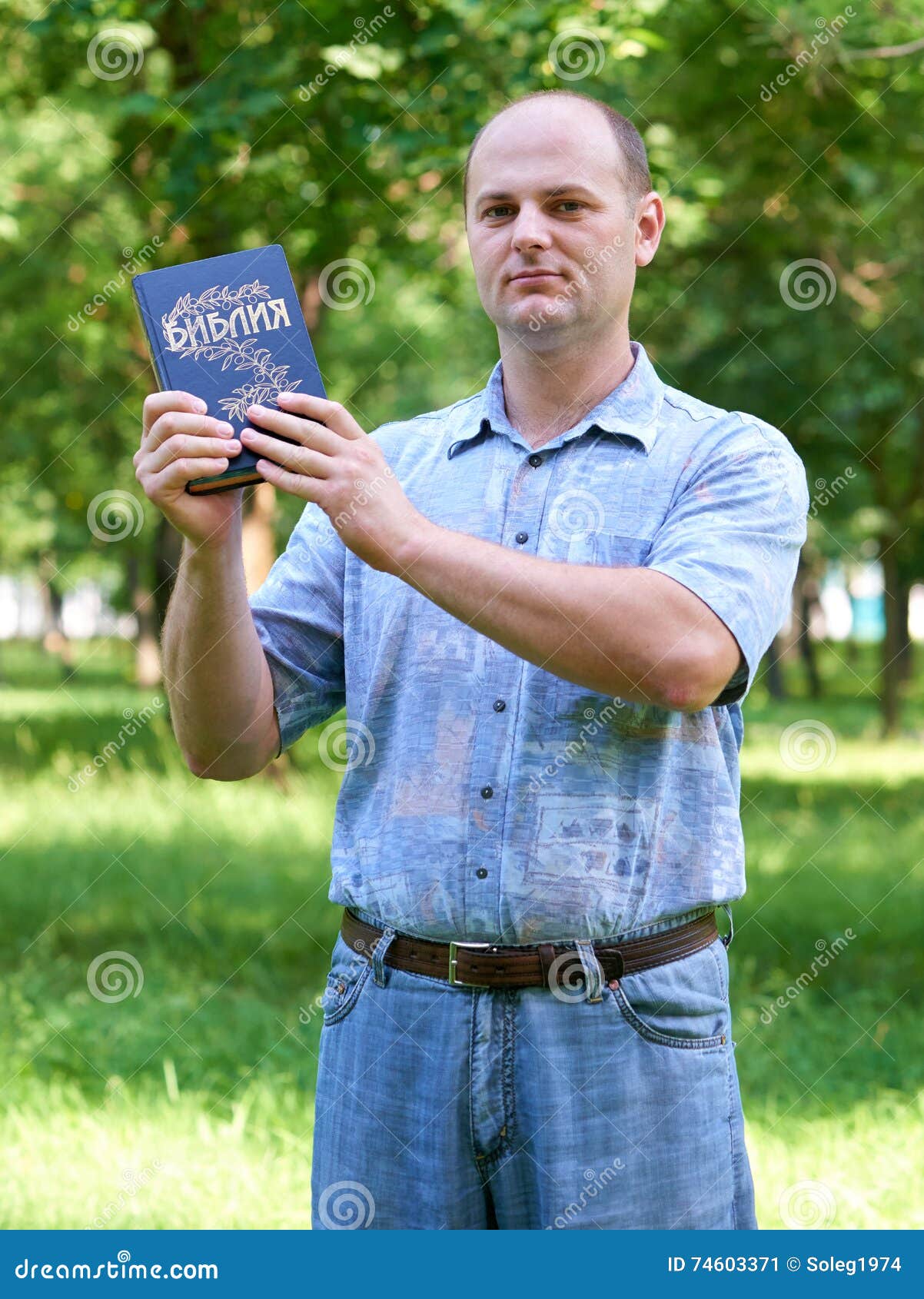 Man with a Bible in His Hand Stock Image - Image of evangelist, blue ...
