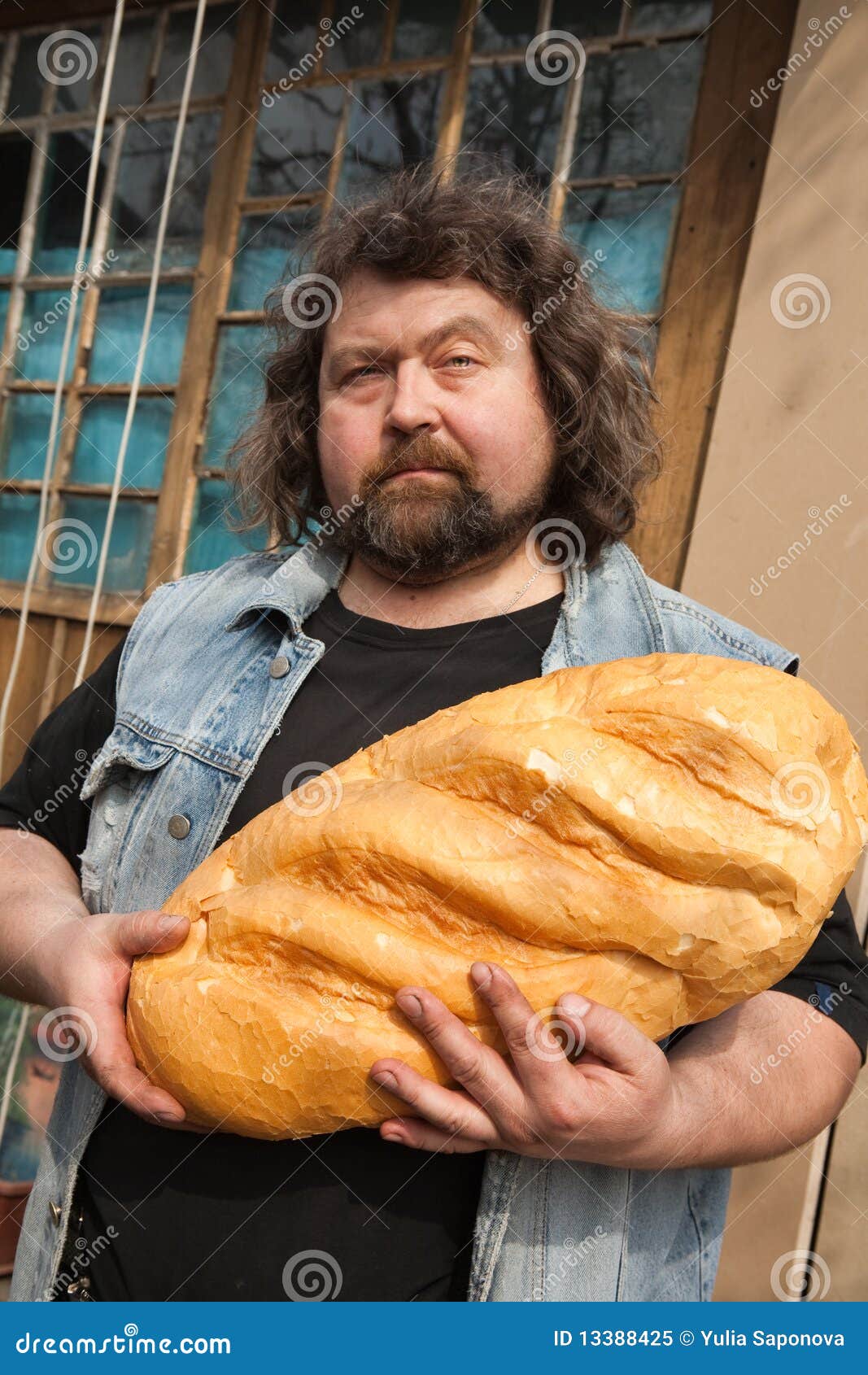 Man with big bread stock image. Image of home, homemade - 13388425