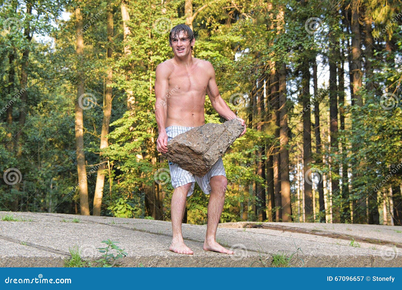 Man with big stone stock image. Image of move, heavy - 67096657