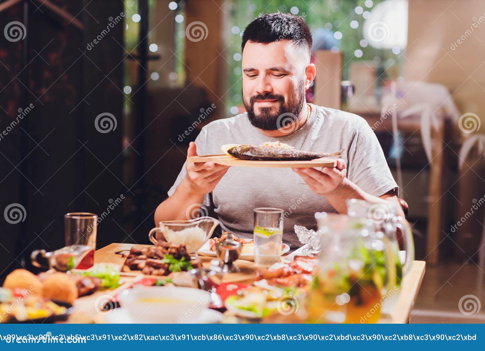 Man at the Big Table with Food. Stock Image - Image of party, family ...