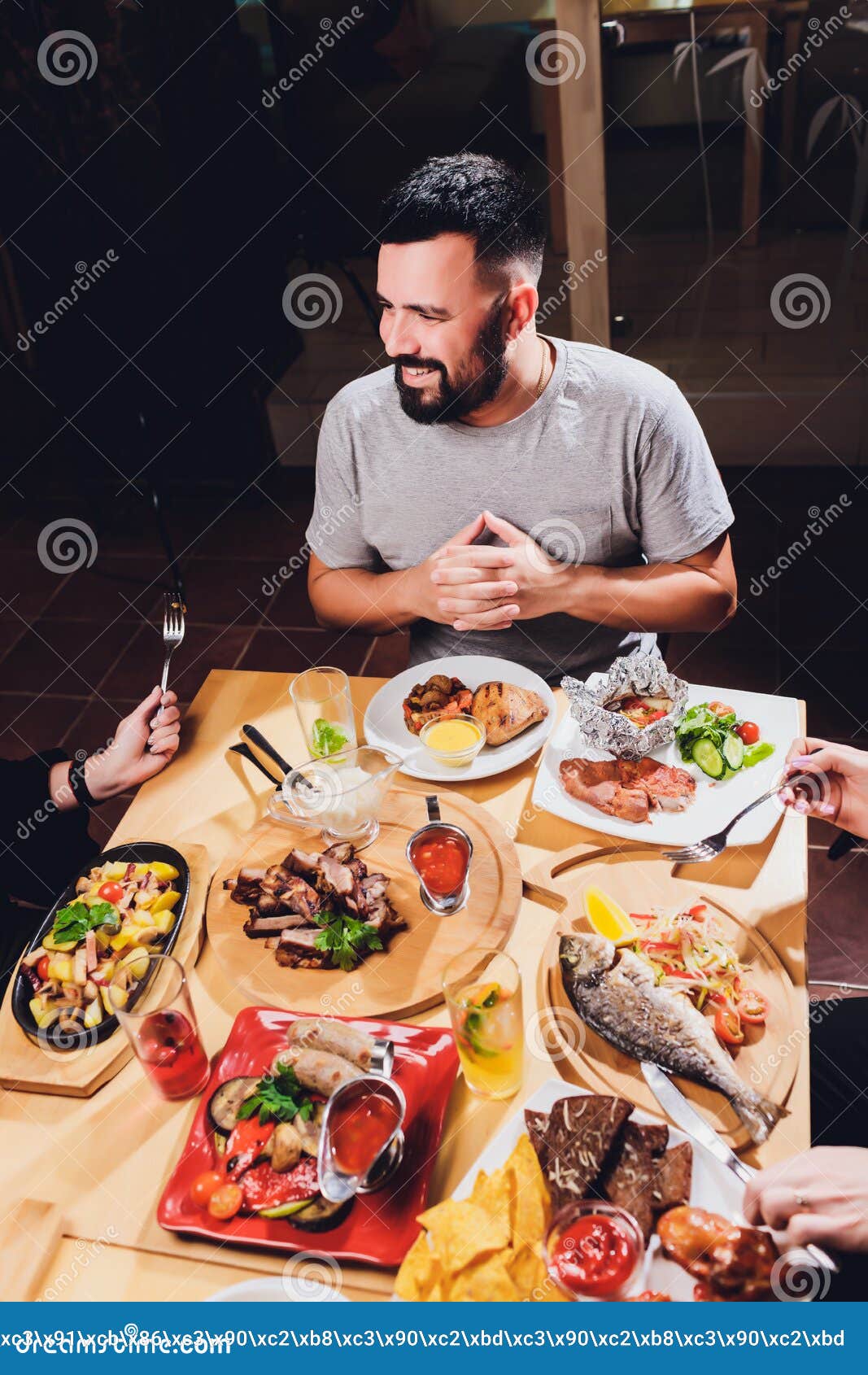 Man at the Big Table with Food. Stock Photo - Image of gourmet, steak ...