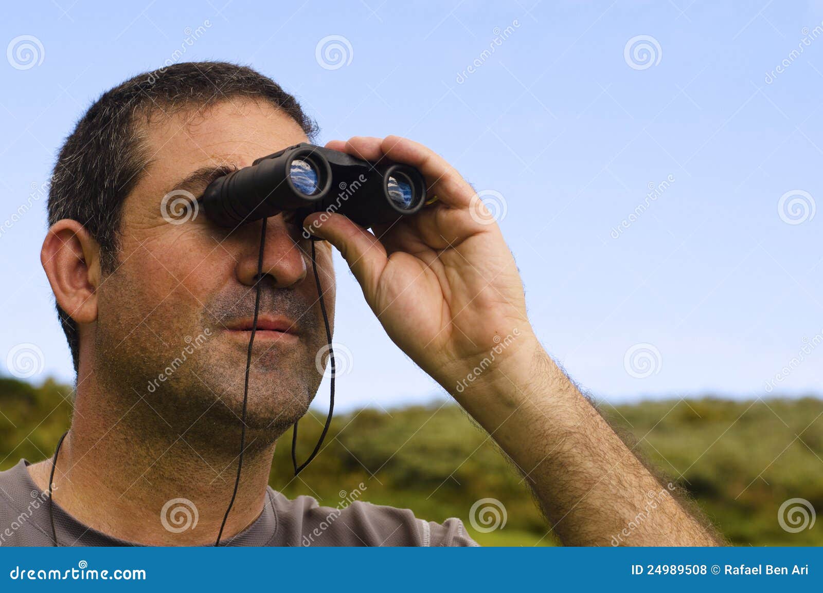 Man With Binoculars stock photo. Image of outdoors, away - 24989508