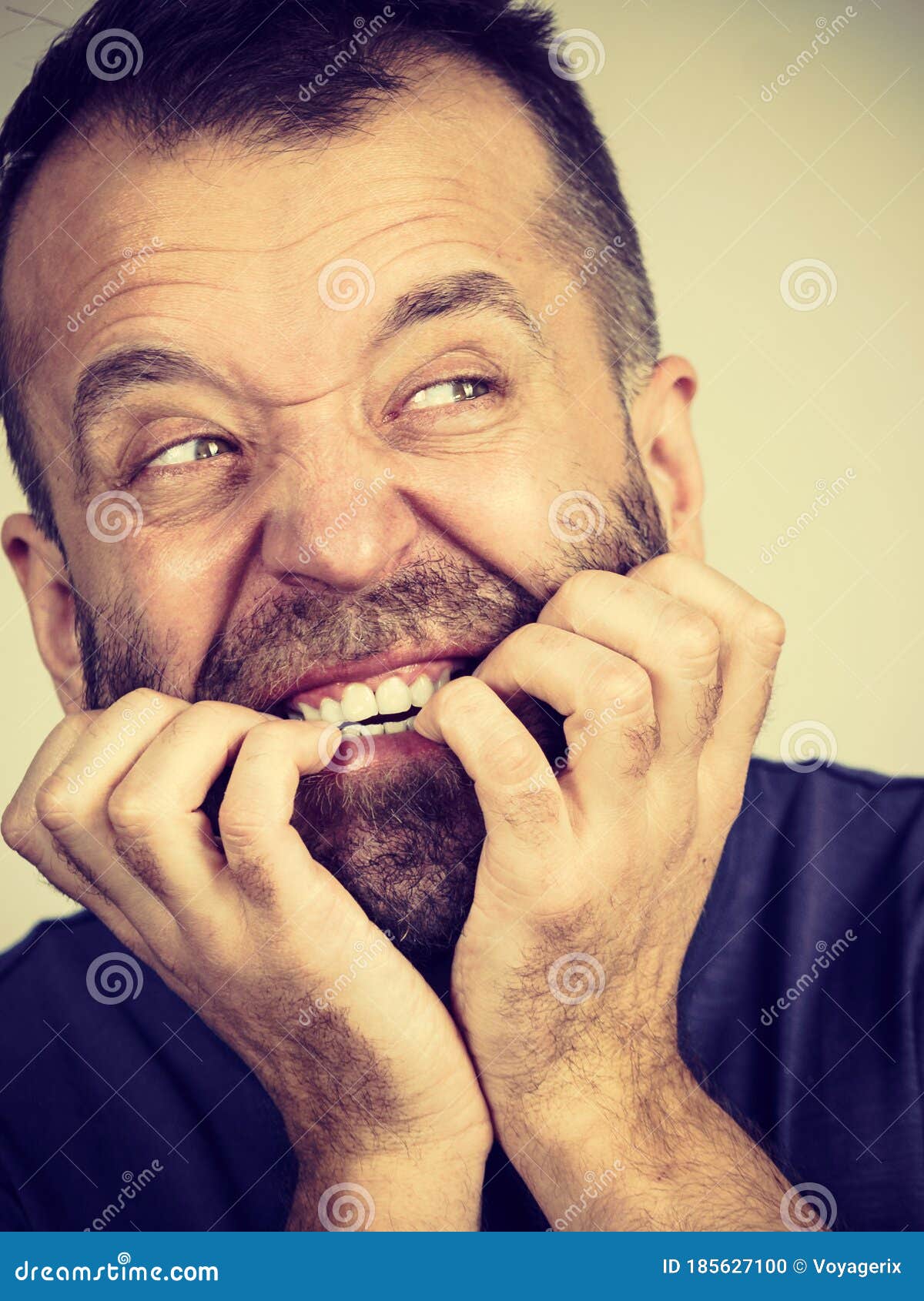 Man biting his nails stock photo. Image of nail, anxiety - 185627100