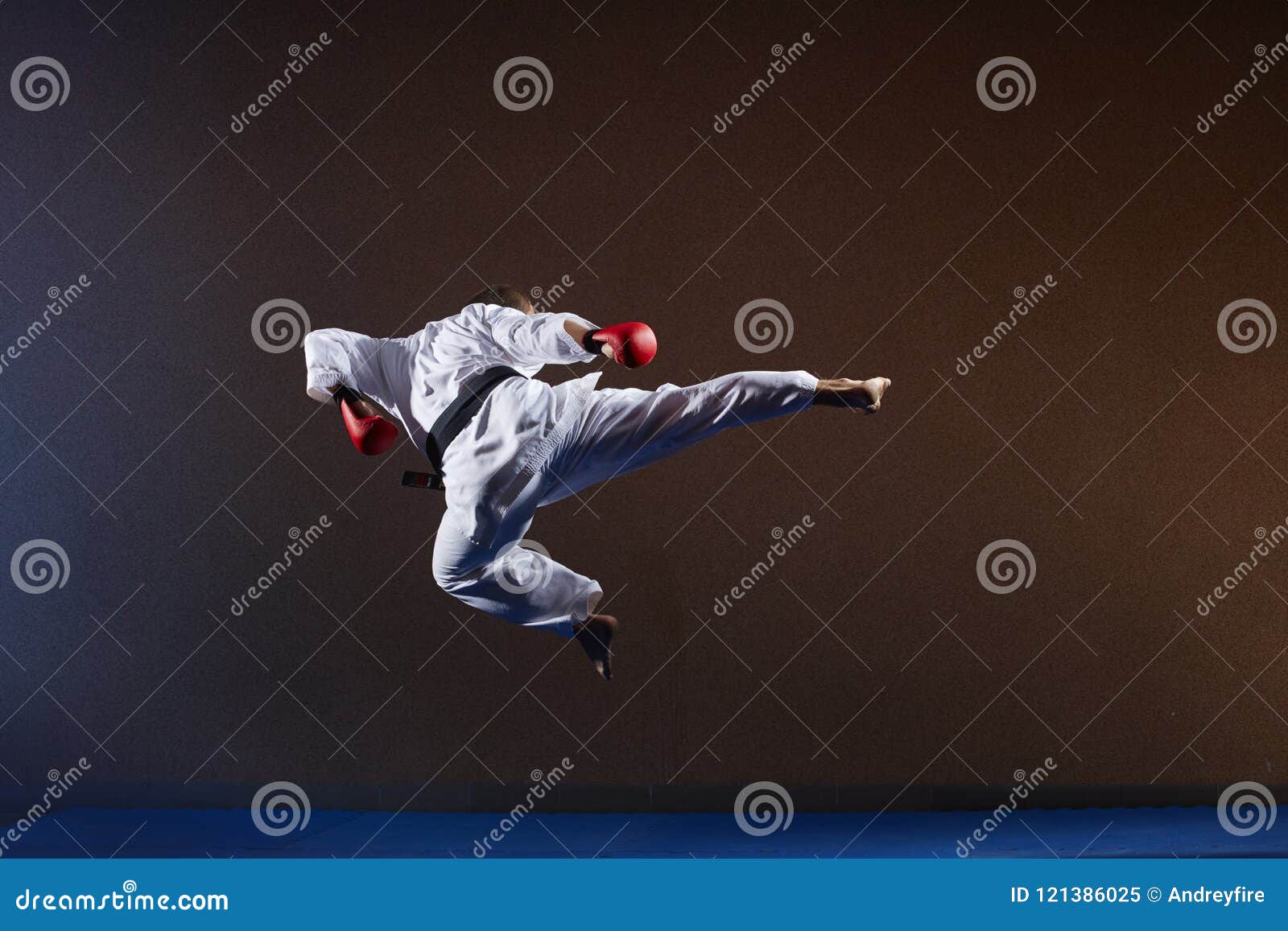 A Man with a Black Belt Beats a Kick in a Jump Stock Image - Image of ...