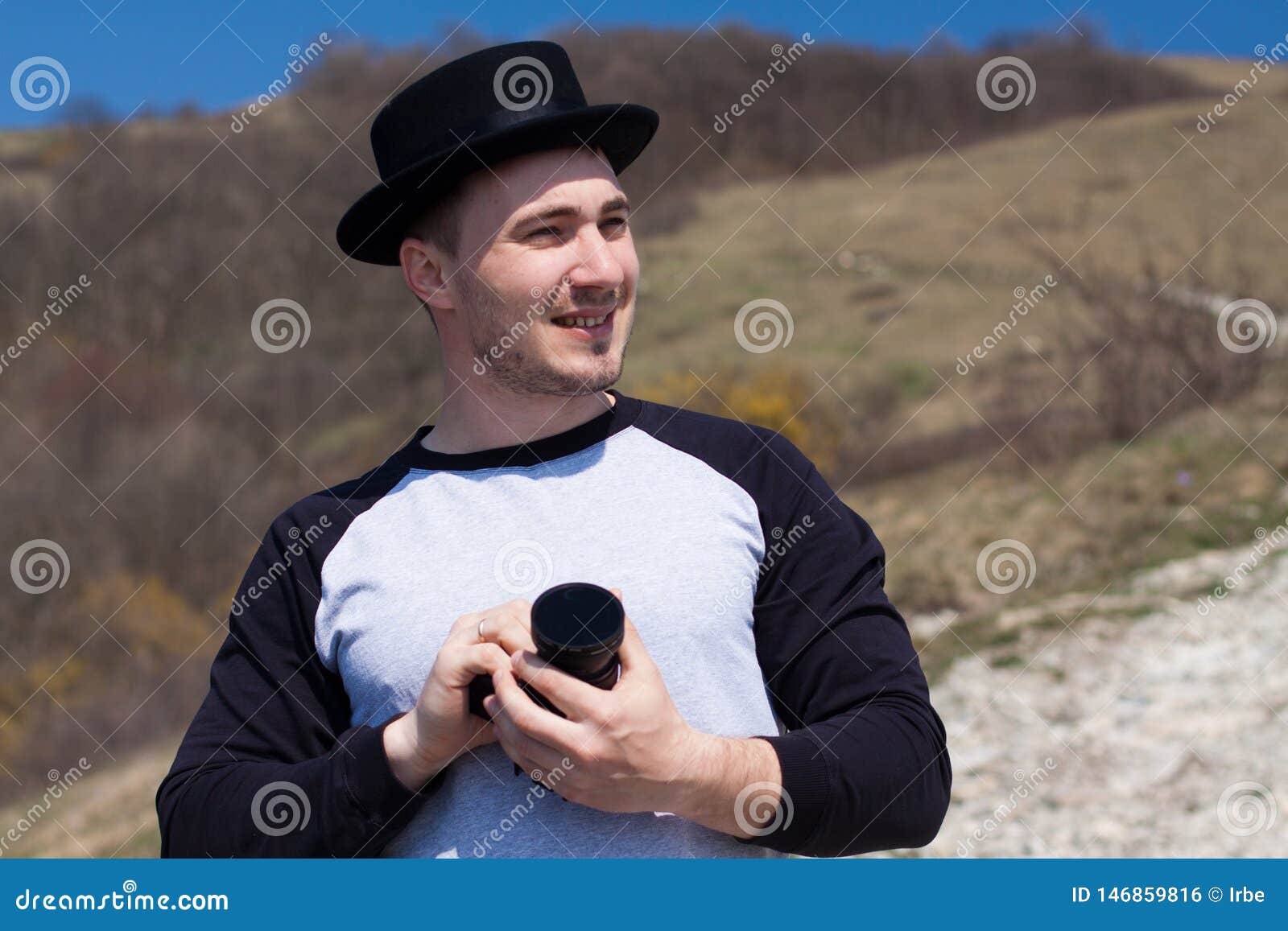 A Man in a Black Hat Take a Camera Stock Photo - Image of technology ...