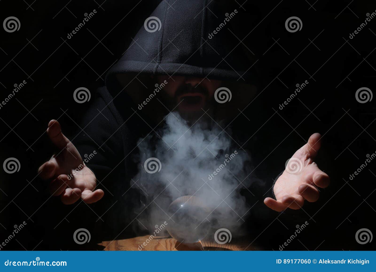 Man in a Black Hood with Cristal Ball Stock Photo - Image of black ...