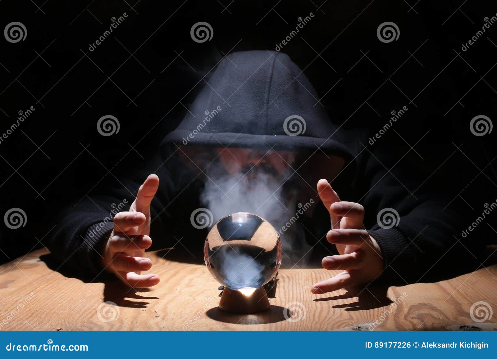 Man in a Black Hood with Cristal Ball Stock Photo - Image of alchemy ...