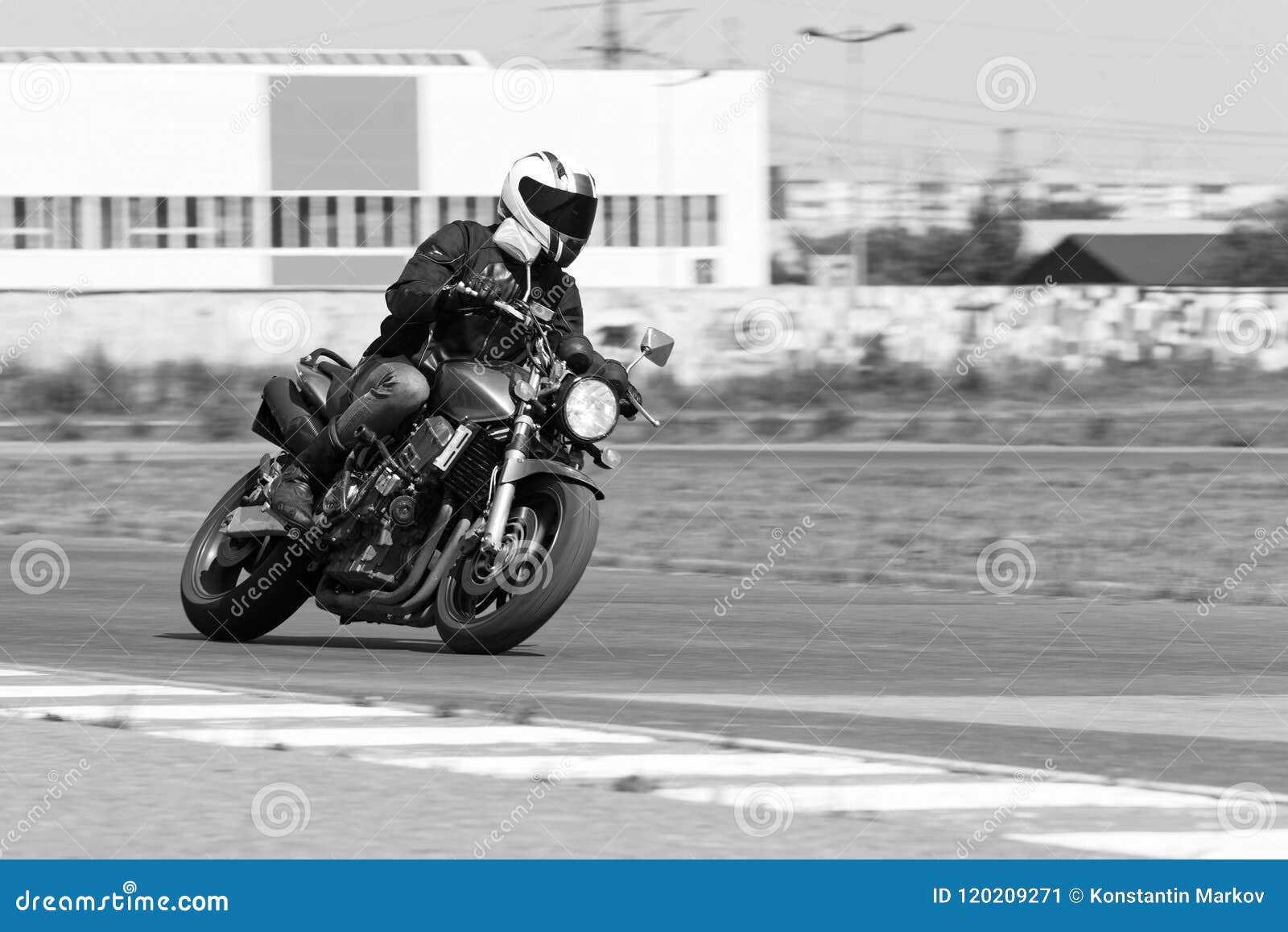 Man in a Black Jacket and Grey Pants Race on a Motorcycle. Stock Image ...