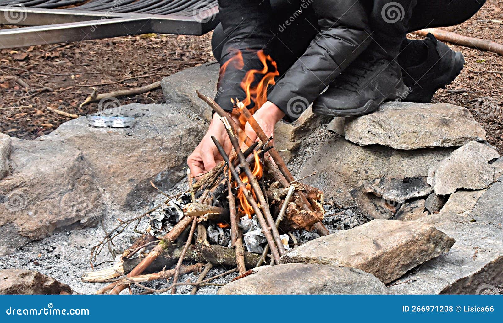 Man Lighting a Fire Outdoors Stock Photo - Image of halt, adventure ...