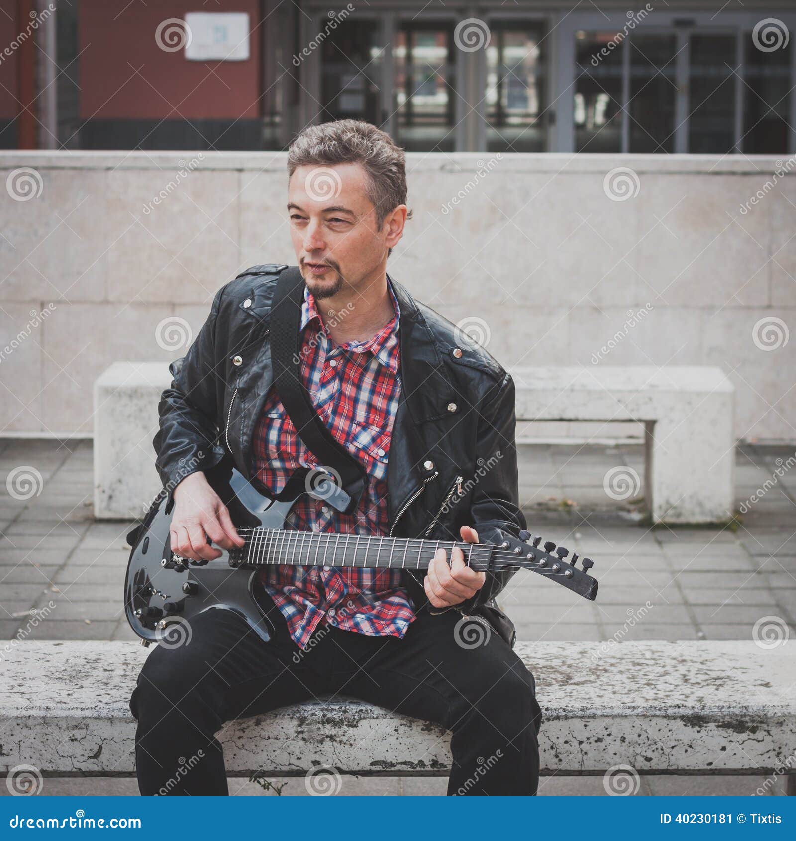 Man in Black Leather Jacket Playing Electric Guitar Stock Image - Image ...