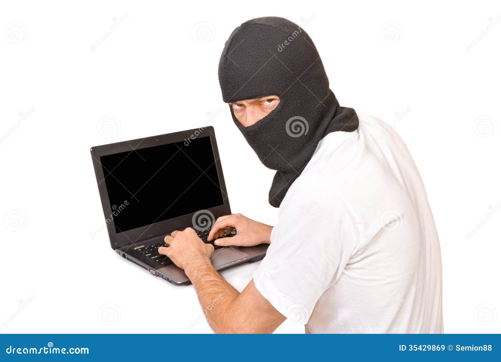 Man in Black Mask Looking at Camera and Typing Something Stock Image ...