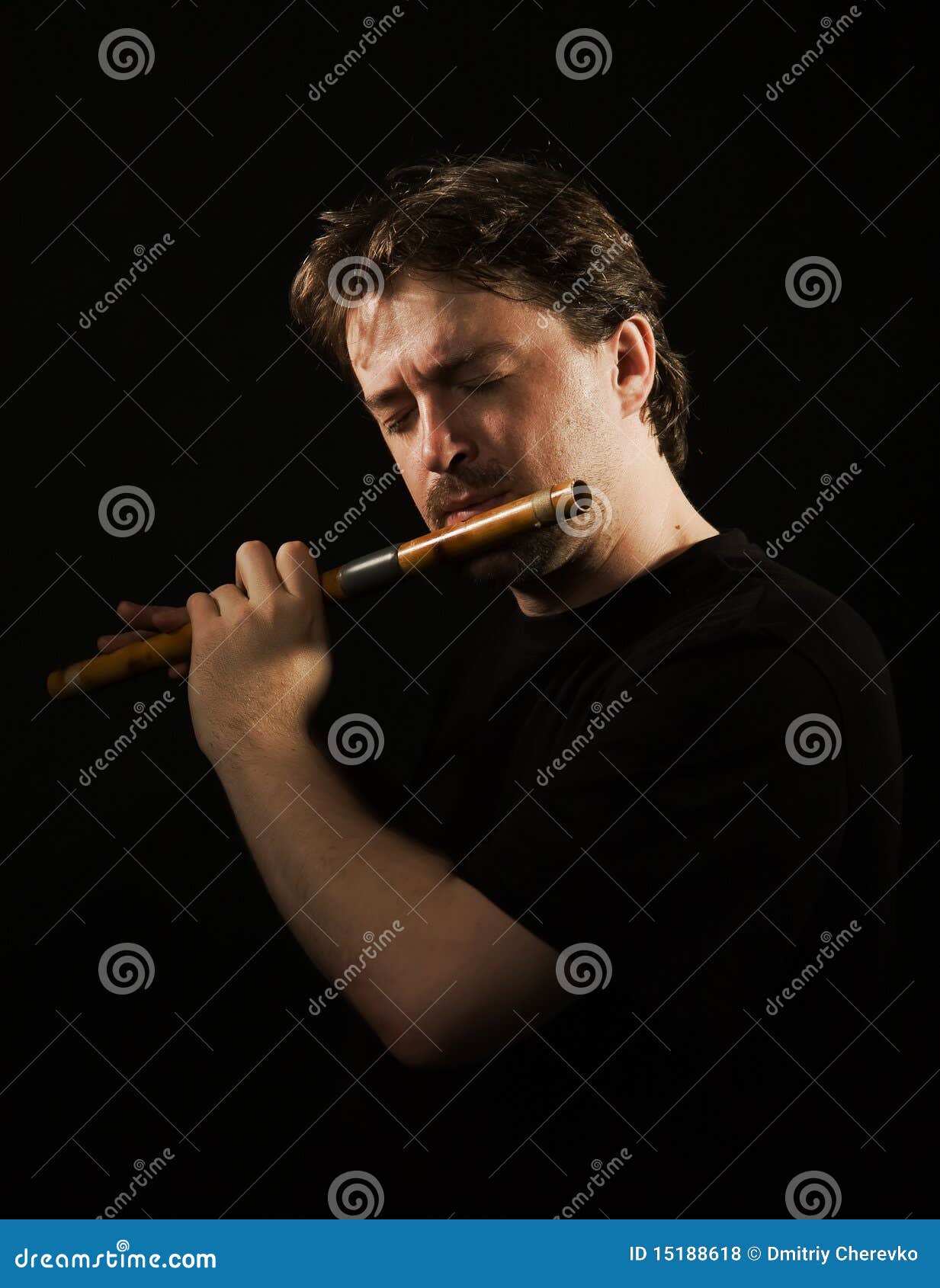 Man in black plays a flute stock photo. Image of performer - 15188618