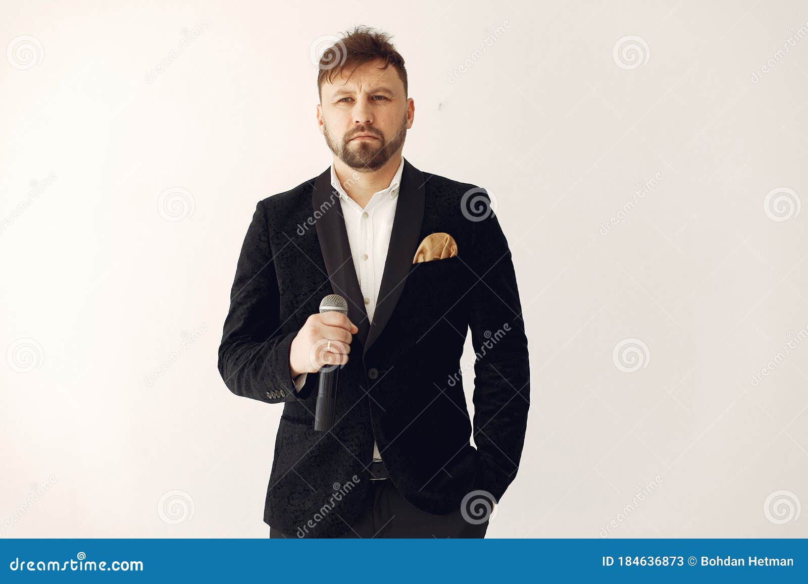Man in Black Suit Standing with a Microphone Stock Image - Image of ...