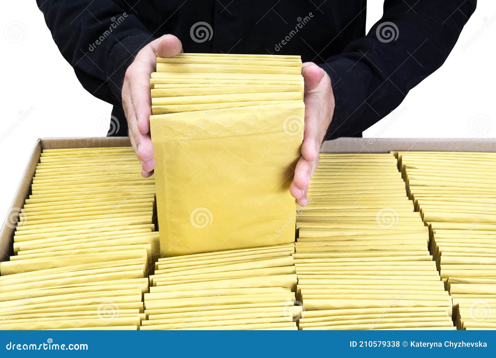 Man in Black Uniform Packing Yellow Padded Bubble Envelopes in a Large ...