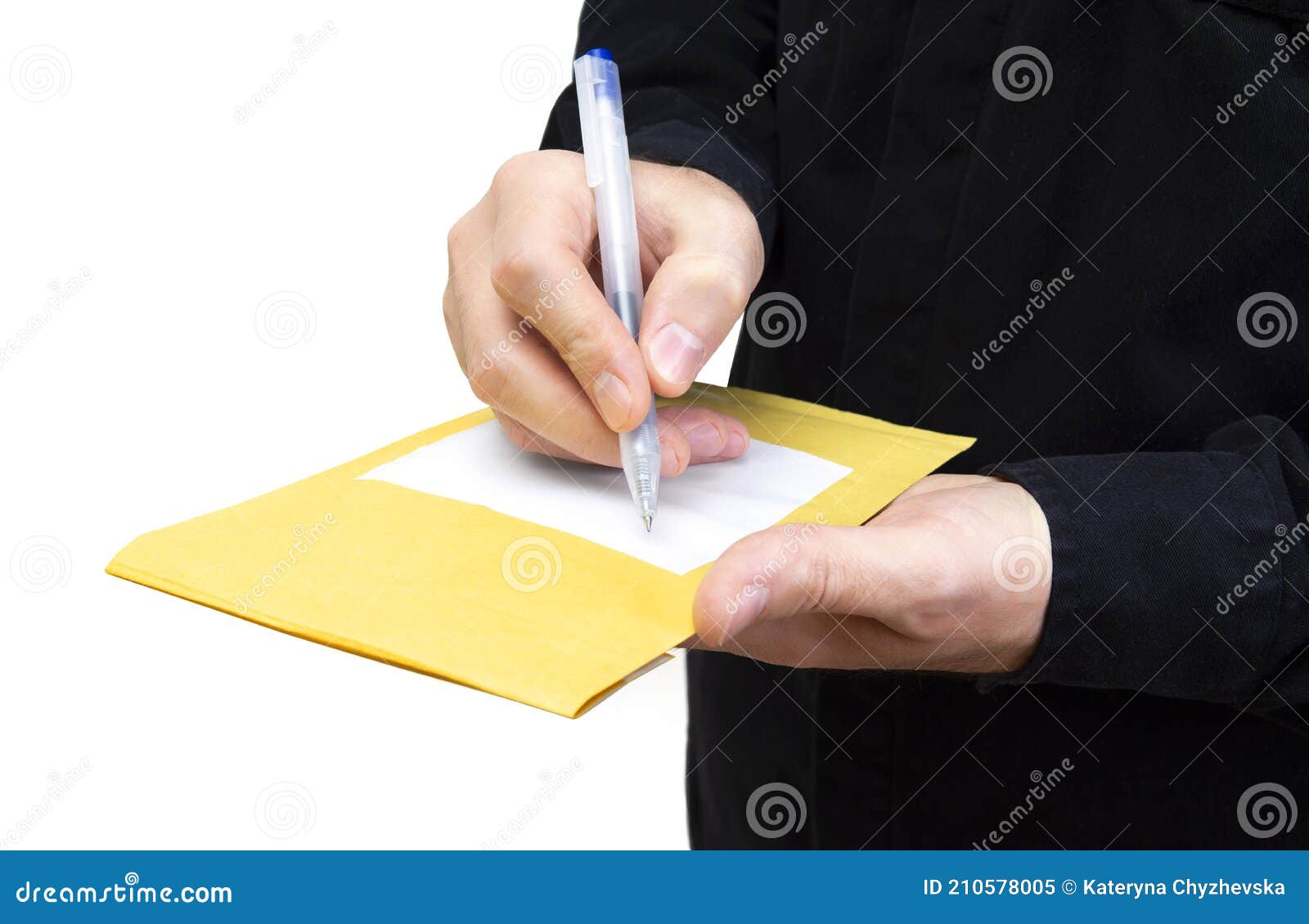 Man in a Black Uniform Writes an Address on a Yellow Padded Envelope ...