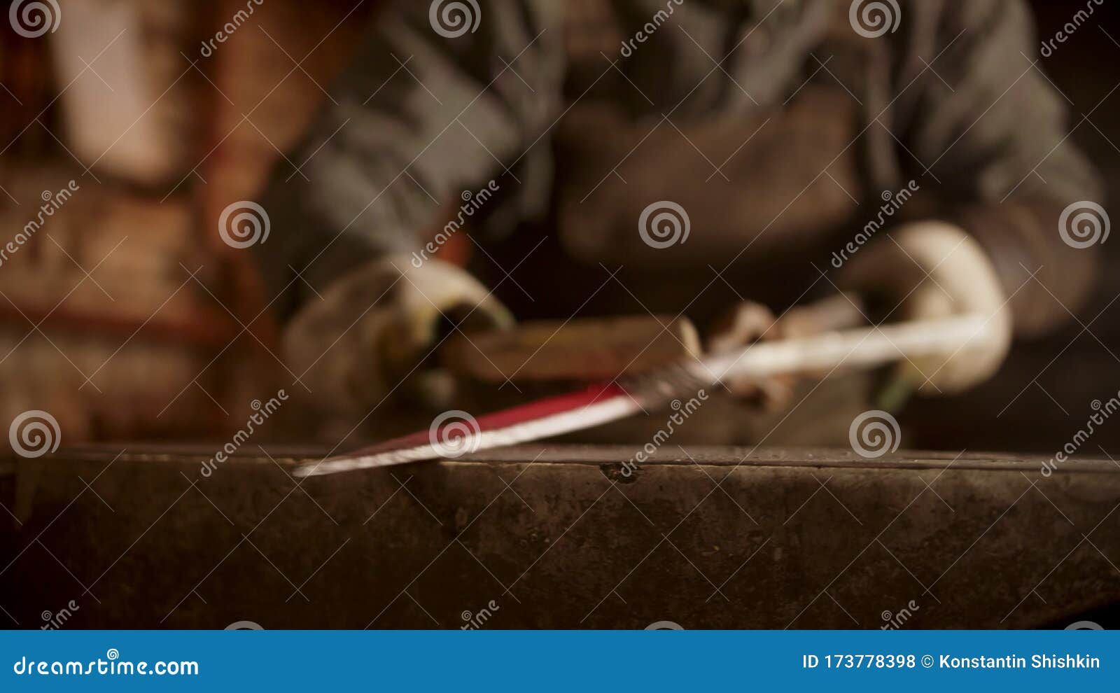 A Man Blacksmith Forging a Knife in Gloomy Workshop Stock Footage ...