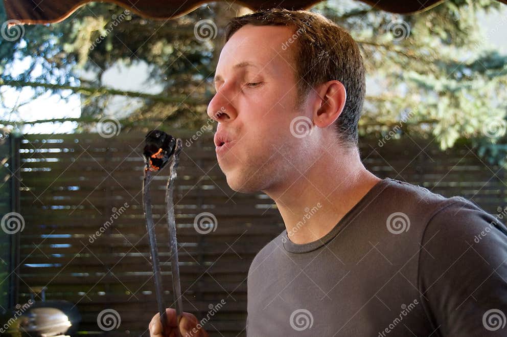Man is blowing fire. stock photo. Image of grilled, burning - 15774178