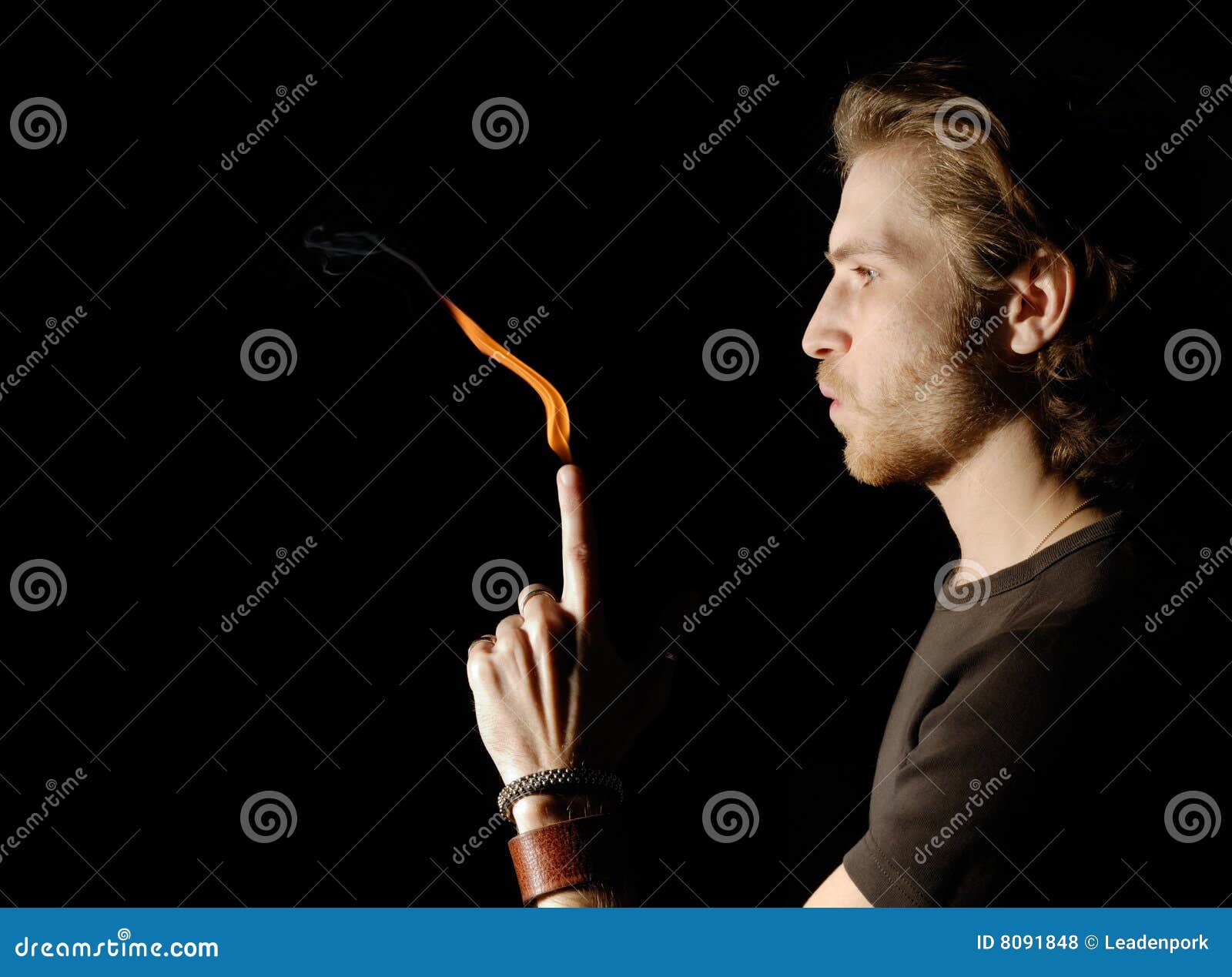 The man blowing off fire stock photo. Image of finger - 8091848